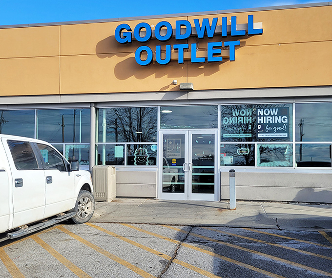 The unassuming exterior of Omaha's Goodwill Outlet belies the treasure-hunting adventure waiting inside. Blue signage beckons bargain seekers like a retail siren song.