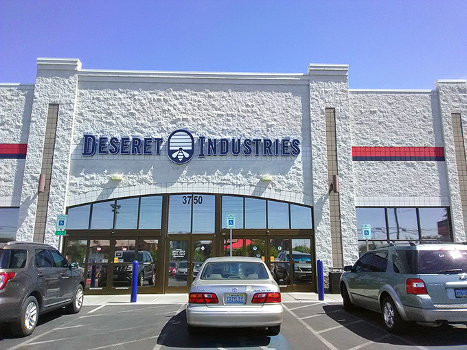 The desert sun gleams off Deseret Industries' pristine white facade, a bargain hunter's oasis amid the Nevada heat. Treasure awaits inside!
