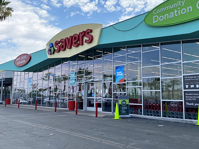 The turquoise-trimmed facade of Savers beckons like a bargain oasis in the desert of retail pricing. Your wallet's new best friend awaits.