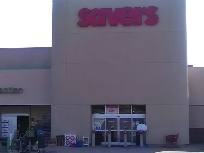 The iconic red Savers sign beckons like a lighthouse for bargain hunters. This unassuming exterior hides a universe of possibilities waiting to be discovered.
