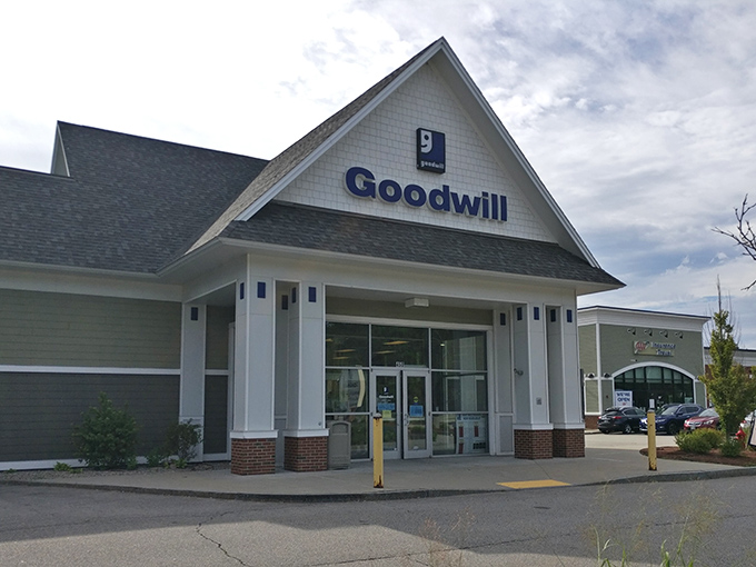 The Somersworth Goodwill welcomes bargain hunters with its distinctive blue signage and clean, inviting exterior&mdash;the gateway to thrifting paradise.