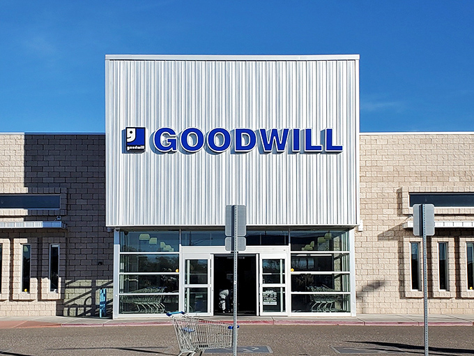 The modern facade of Goodwill in Rio Rancho stands like a beacon of bargain possibilities, promising treasures behind those glass doors.