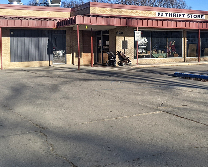 The unassuming exterior of St. Joseph's Thrift Store &ndash; where budget-friendly treasures await behind brick and glass.