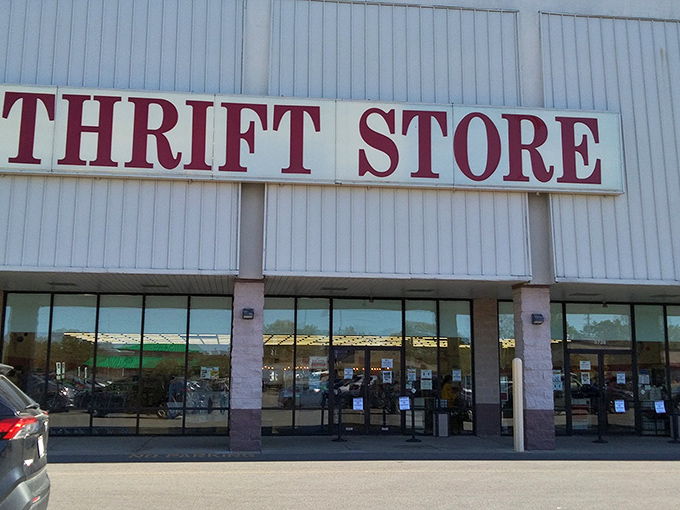 The bold red lettering against white siding isn't just signage—it's a promise of treasure hunting adventures waiting inside those glass doors.