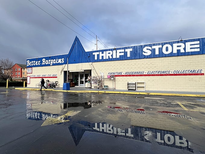 The blue-fronted wonderland of Better Bargains stands ready for treasure hunters, its puddle-reflected sign promising adventures within.