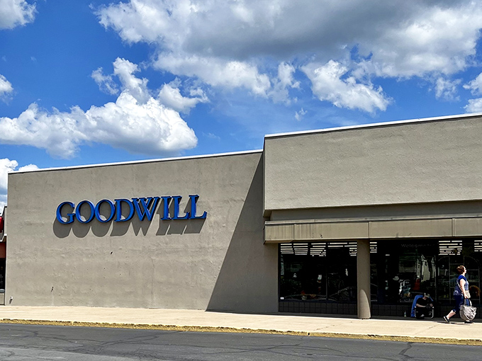 The unassuming beige exterior of Warminster's Goodwill hides a treasure trove within, like a plain book cover concealing a thrilling story.