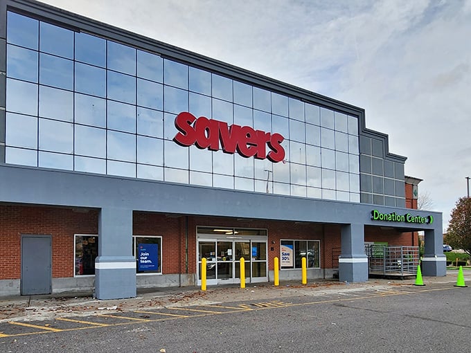 The gleaming glass facade of Savers in Warwick stands like a cathedral to second-hand treasures, its red signage a beacon to bargain hunters everywhere.