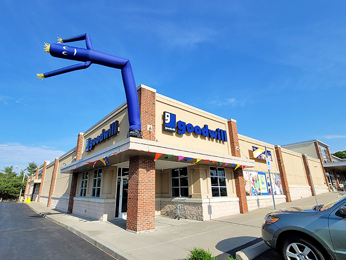 The iconic blue inflatable tube man waves you into bargain paradise. Goodwill Warwick's exterior promises treasures within those beige walls.