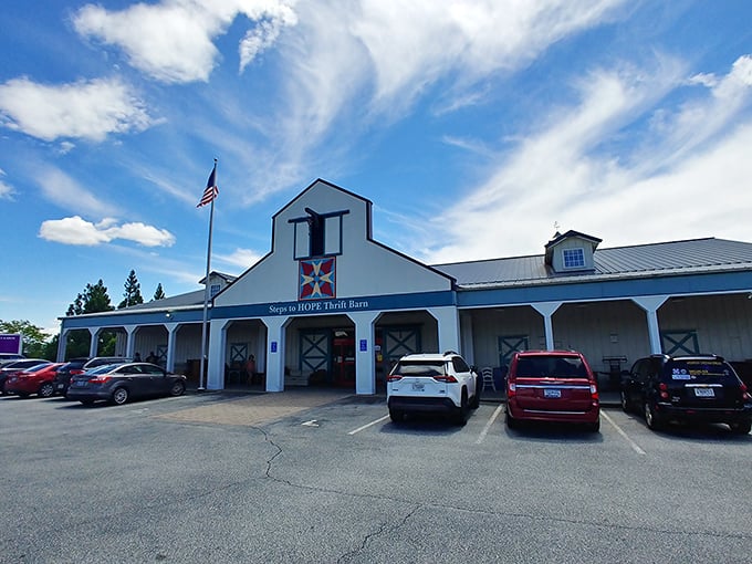 Blue skies frame this thrifter's paradise, where the American flag waves a patriotic hello and the spacious parking lot hints at the treasures waiting inside.