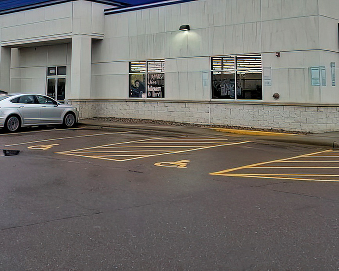 The building's blue-trimmed exterior beckons bargain hunters like a lighthouse guiding ships to treasure-filled shores.