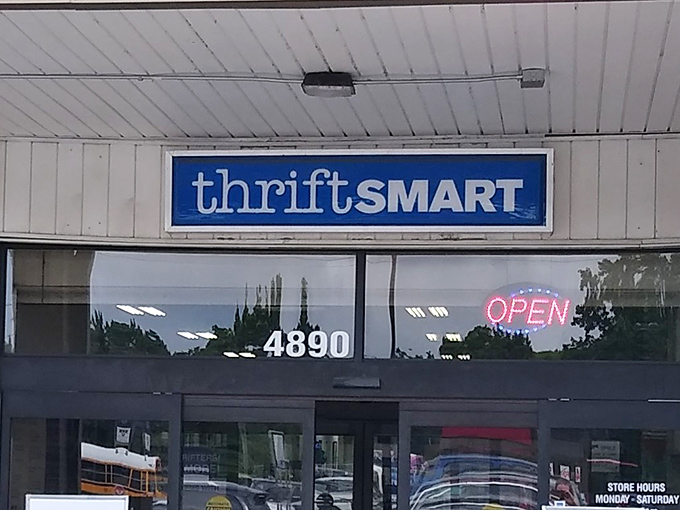 The iconic blue and white ThriftSmart sign beckons treasure hunters like a siren call to bargain paradise.
