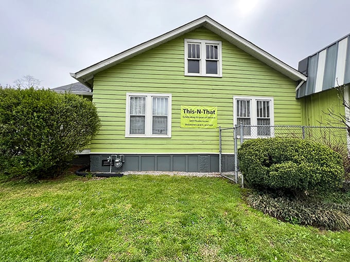 The lime-green exterior of This 'n That Thrift Shop stands out like a peacock at a penguin convention, beckoning bargain hunters with promises of treasures within.