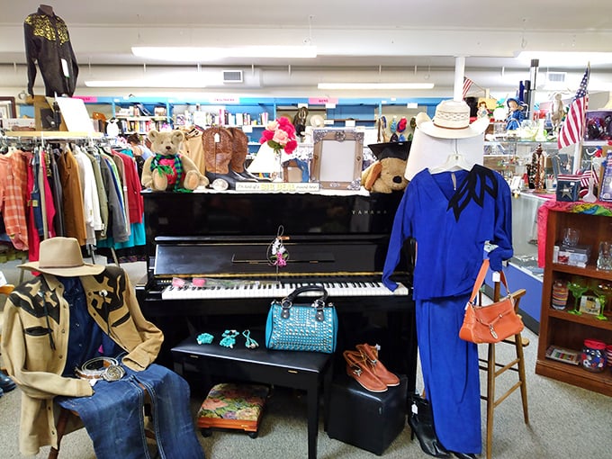 A Yamaha piano surrounded by fashion finds creates an impromptu stage. One minute you're shopping for a jacket, the next you're channeling Elton John at a Wyoming thrift store concert.