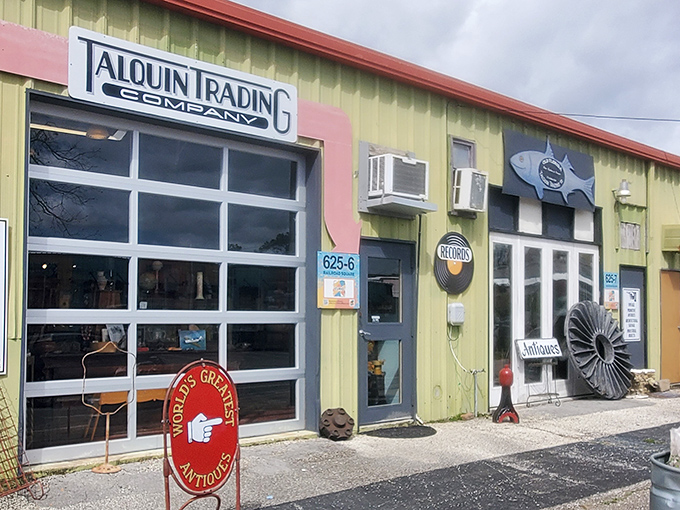 The cheerful yellow exterior of Talquin Trading Co. beckons treasure hunters with its "World's Greatest Antiques" sign—a promise it somehow manages to keep.