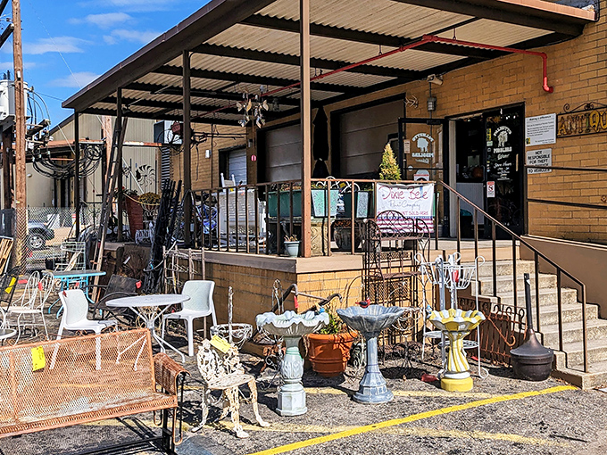 The unassuming entrance to treasure-hunting paradise. Garden ornaments and wrought iron furniture stand guard, teasing what awaits inside.