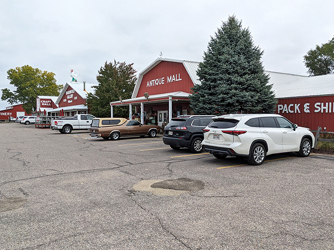 The iconic red barn exterior of Wisconsin Dells Antique Mall stands like a beacon for treasure hunters, promising adventures in vintage wonderland.
