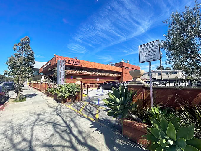 The terra cotta-colored exterior of Bay Cities stands like a culinary lighthouse on Lincoln Boulevard, beckoning sandwich pilgrims from across Los Angeles County.