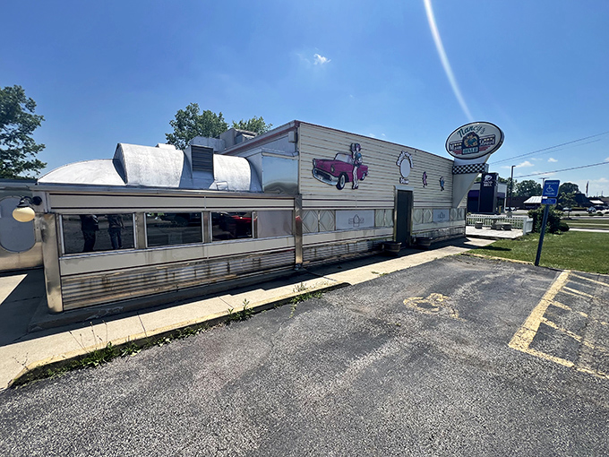 The classic silver exterior of Nancy's Main Street Diner gleams in the Ohio sunshine, a chrome time capsule promising comfort food treasures within.