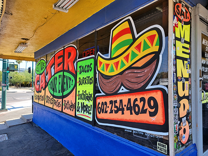The vibrant exterior of El Norteño screams "authentic Mexican food lives here!" with its colorful signage and no-nonsense charm.