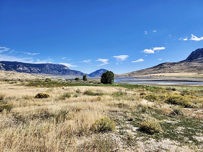 Nature's own hiking paradise awaits on this sage-dotted trail. The mountains stand like ancient guardians, beckoning adventurers into Wyoming's embrace.