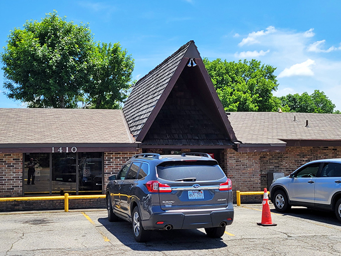 The iconic A-frame roof of Feltner's stands like a burger beacon, calling hungry travelers from miles around. No architectural awards here&mdash;just the promise of legendary patties waiting inside.