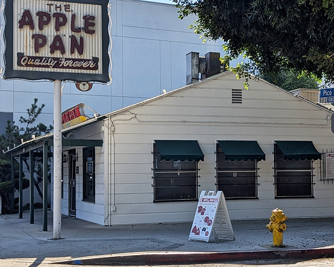 That vintage sign isn't just nostalgia—it's a beacon calling burger pilgrims home to simpler, tastier times.
