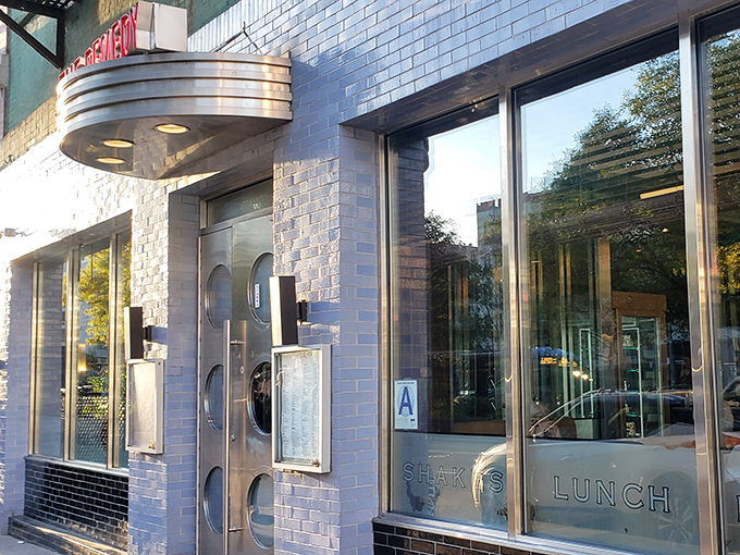 The iconic blue-tiled exterior of Remedy Diner stands out like a sapphire in the concrete jungle, complete with a retro marquee that practically whispers "comfort food ahead."