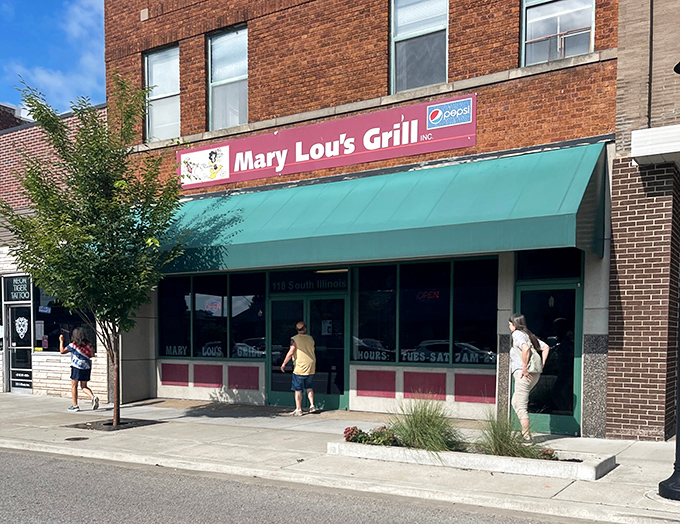 The unassuming brick exterior with its modest green awning hides culinary treasures that have kept locals coming back for generations.