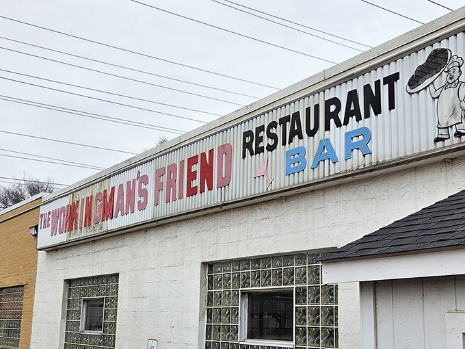 The iconic corrugated metal sign beckons hungry travelers like a culinary lighthouse. No fancy frills, just the promise of honest food inside.