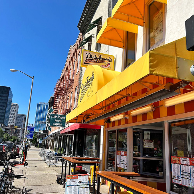That sunshine-yellow awning isn't just a beacon for hungry downtown Columbus wanderers—it's practically a bat signal for hot dog enthusiasts.