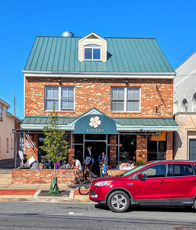 The charming brick exterior with its distinctive green roof and peach blossom logo promises culinary adventures within. Newark's breakfast scene has found its crown jewel.