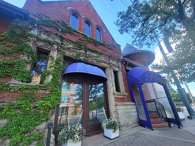 The historic facade of The Precinct welcomes you with ivy-draped charm and those signature blue awnings&mdash;like a culinary time machine disguised as Cincinnati's most elegant former police station.