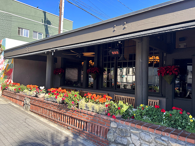 Step into The Kettle, where the cozy patio and fresh flowers invite you to enjoy a delicious meal.