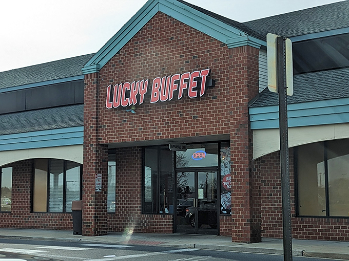 The brick fa&ccedil;ade of Lucky Buffet stands like a culinary lighthouse in Bear, Delaware, beckoning hungry travelers with its glowing red sign.