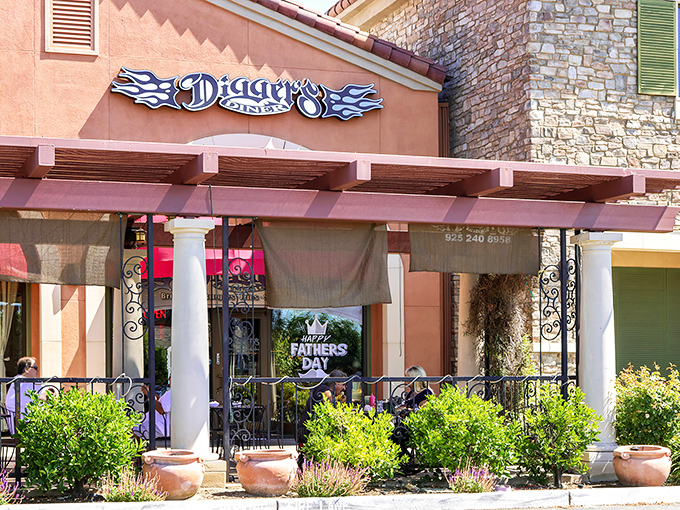 Digger's Diner welcomes you with its distinctive blue-flamed logo and inviting patio entrance&mdash;California casual meets classic Americana in Brentwood's breakfast paradise.