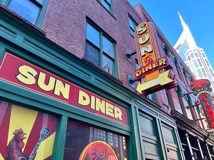 That iconic neon sign glows against the Nashville skyline, promising breakfast salvation to both early birds and night owls alike.