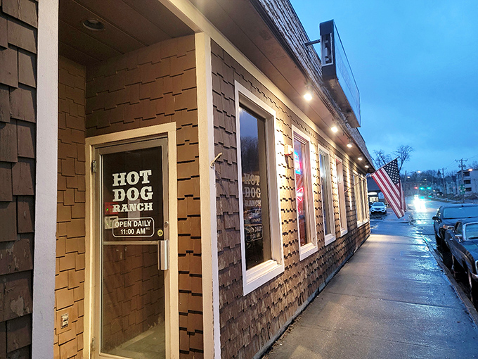 Nothing says "local institution" quite like a proudly displayed American flag and a straightforward sign announcing your hot dog headquarters.
