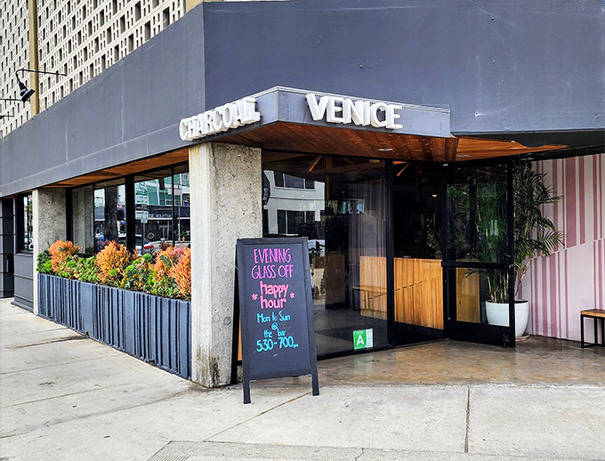 The unassuming exterior of Charcoal Venice stands like a culinary speakeasy, with electric scooters standing guard. Venice cool meets meat-lover's paradise.