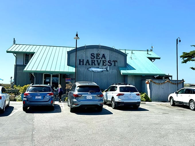 The corrugated metal exterior says "working harbor" not "tourist trap." This unassuming seafood haven promises authenticity before you even step inside.