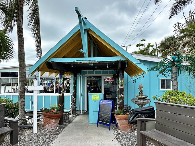 The turquoise beacon of seafood salvation beckons with its distinctive A-frame entrance, promising Florida flavors without the fuss.