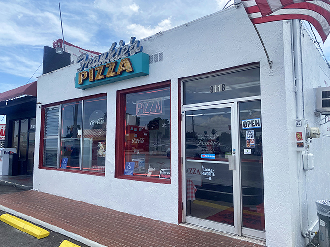 That vintage turquoise sign against Miami's blue sky isn't just advertising pizza&mdash;it's broadcasting a siren call to your taste buds.