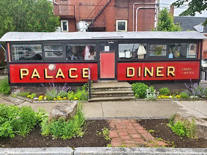 The iconic red exterior of Palace Diner beckons like a time machine disguised as a train car. Maine's culinary treasure hiding in plain sight.