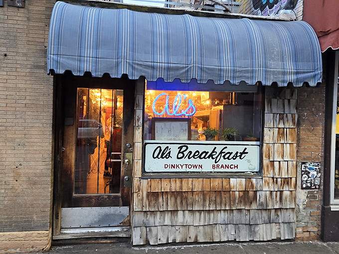 The blue-striped awning and weathered shingles of Al's aren't just charming&mdash;they're a beacon of breakfast hope in Dinkytown's bustling landscape.