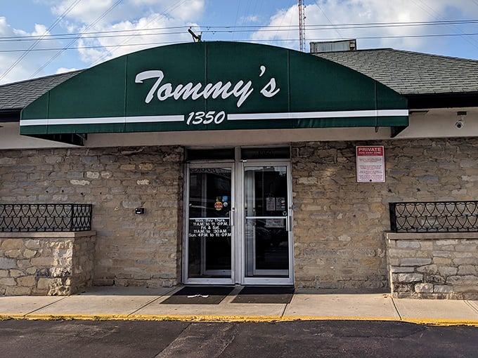 The unassuming stone exterior of Tommy's Pizza hides culinary treasures that have kept Columbus residents coming back for generations.