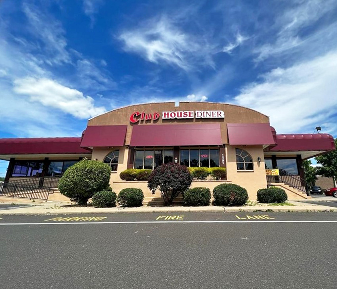 The beige and burgundy exterior of Club House Diner stands proudly against a brilliant blue Pennsylvania sky, like a beacon calling hungry travelers home.