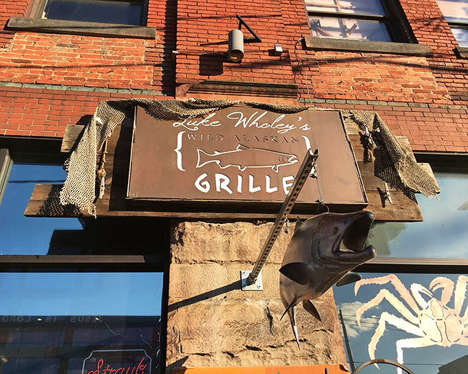 The rustic sign with its fishing net accents and mounted fish tells you everything: this isn't seafood theater &ndash; it's seafood gospel.