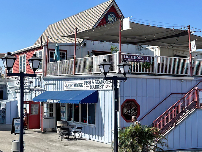 The quintessential coastal charm of Lighthouse Oyster Bar & Grill beckons from Oceanside Harbor like a siren song for seafood lovers.