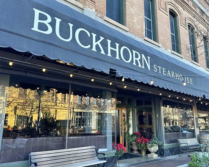 The historic brick façade of Buckhorn Steakhouse stands proudly on Main Street in Winters, like a time capsule of California's ranching heritage waiting to be explored.
