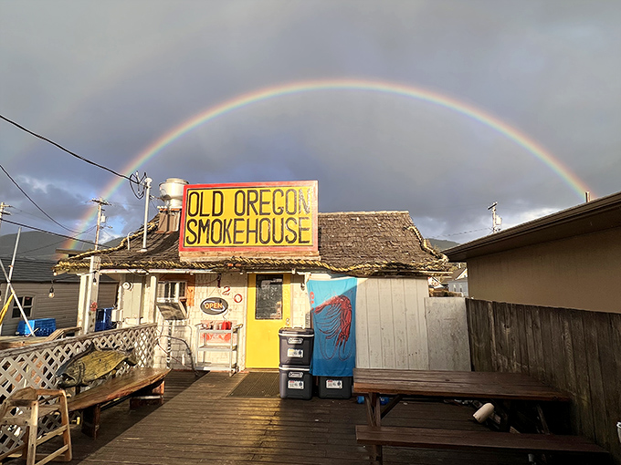 A perfect rainbow arches over the Old Oregon Smokehouse like Mother Nature's own seal of approval. Even the sky celebrates this seafood sanctuary.