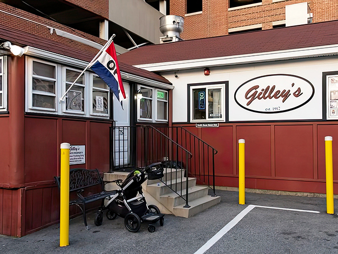 The classic red exterior of Gilley's stands proudly in Portsmouth, a time capsule of Americana where burger dreams come true.